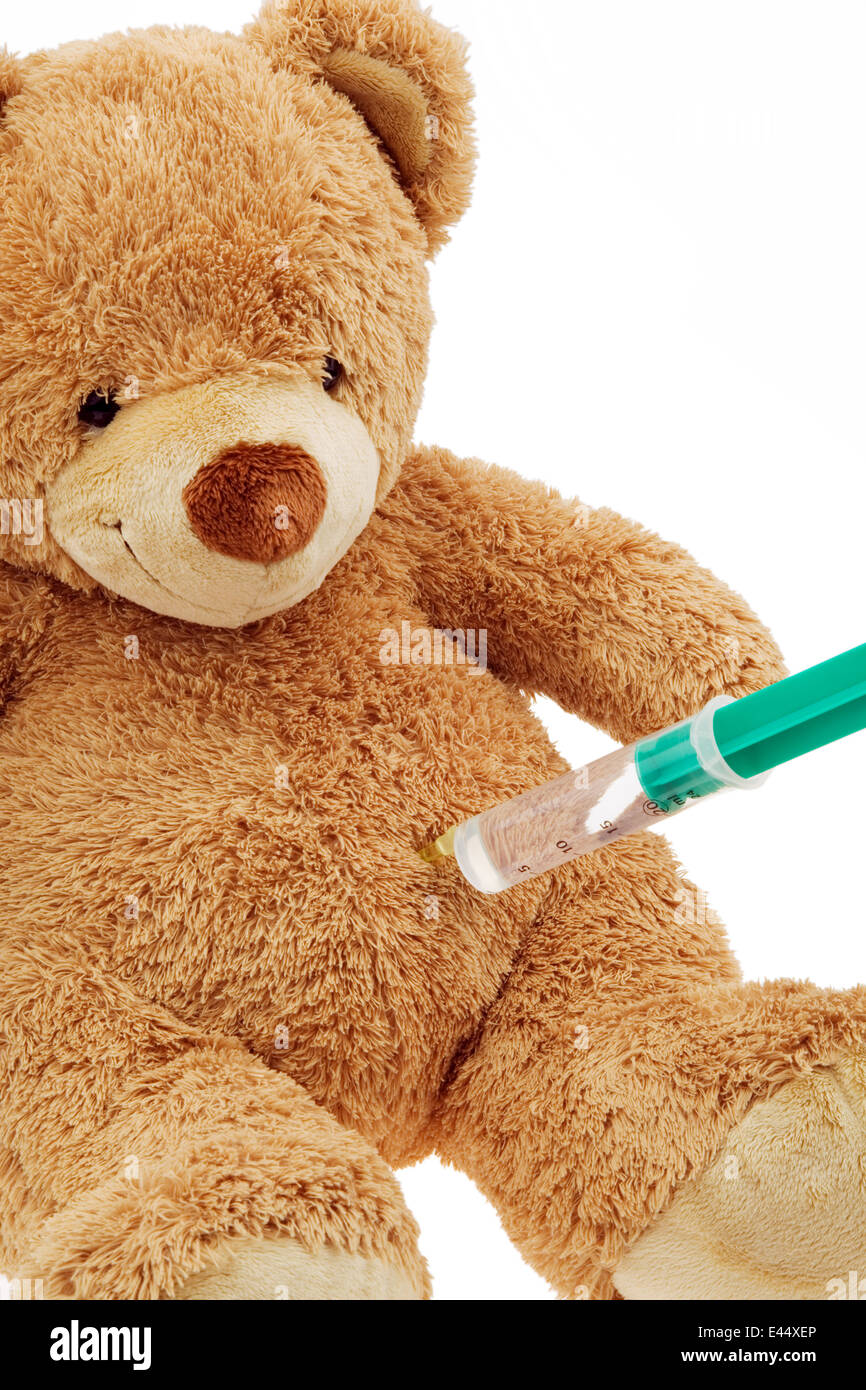 A Teddy gets an injection. Vaccination and syringe Stock Photo - Alamy