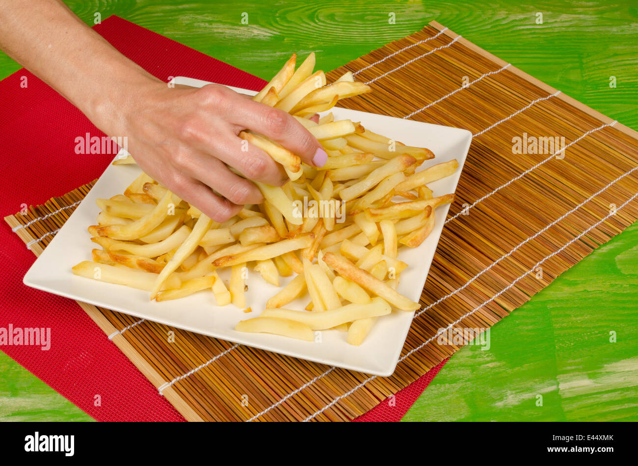 French fries hand food female hi-res stock photography and images - Alamy