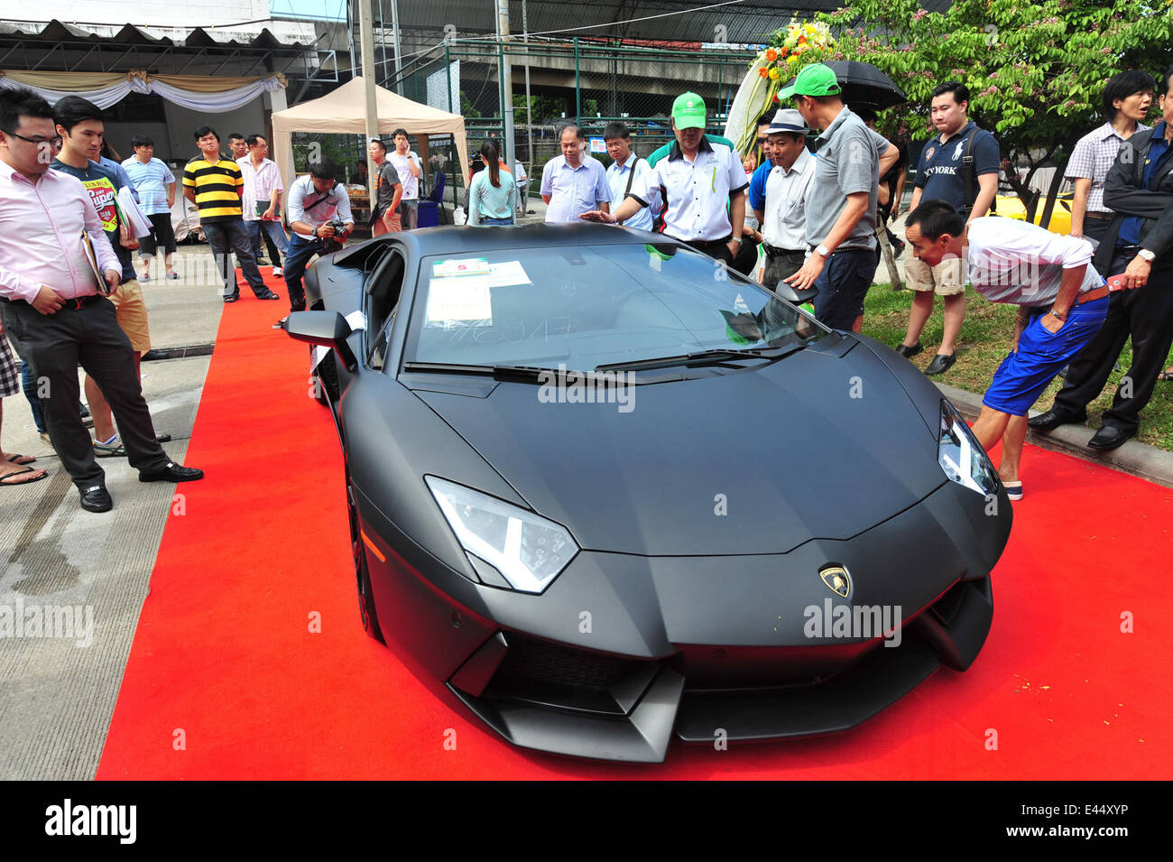 Bangkok, Thailand. 3rd July, 2014. People look at a smuggled car during ...