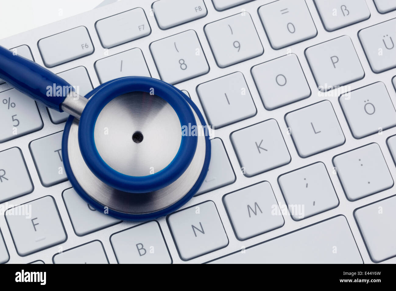 A stethoscope is on the keyboard of a computer Stock Photo - Alamy