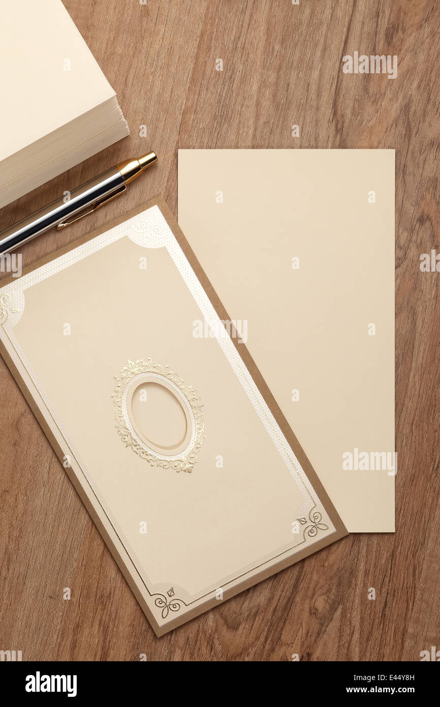 Blank vintage invitation card on wooden table Stock Photo - Alamy