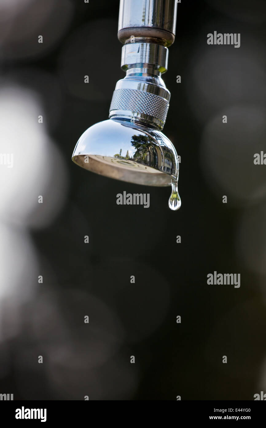 The water drops of a shower. Shower stands in the garden Stock Photo ...