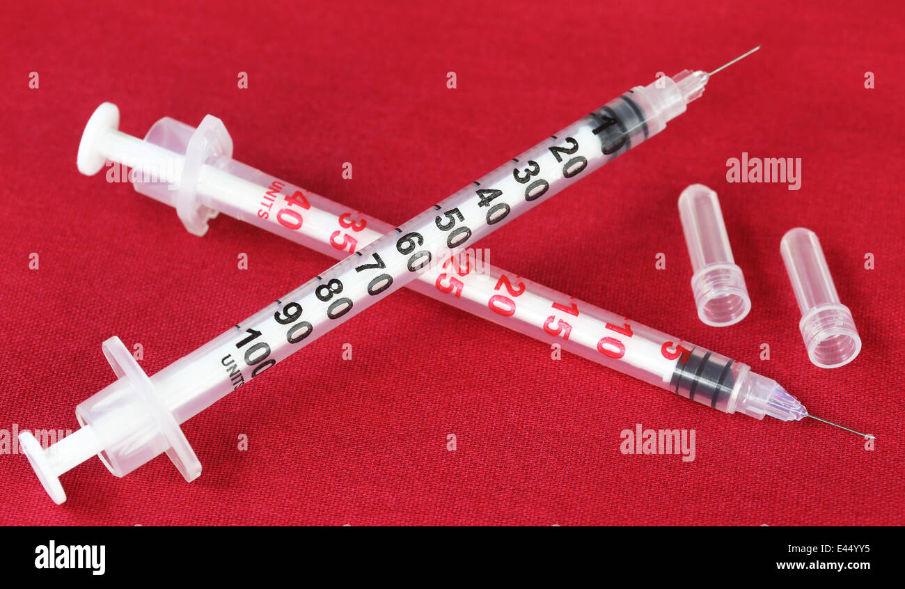 Close up of two hypodermic syringes Stock Photo - Alamy
