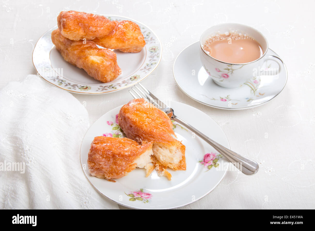 Yum yum's/iced sticky twisted donut fingers for afternoon tea set on ...