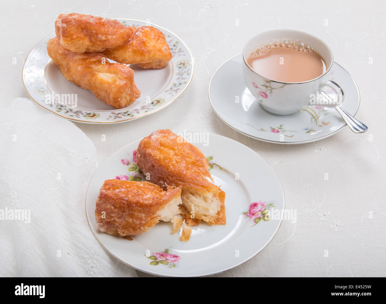 Yum yum's/iced sticky twisted donut fingers for afternoon tea set on ...