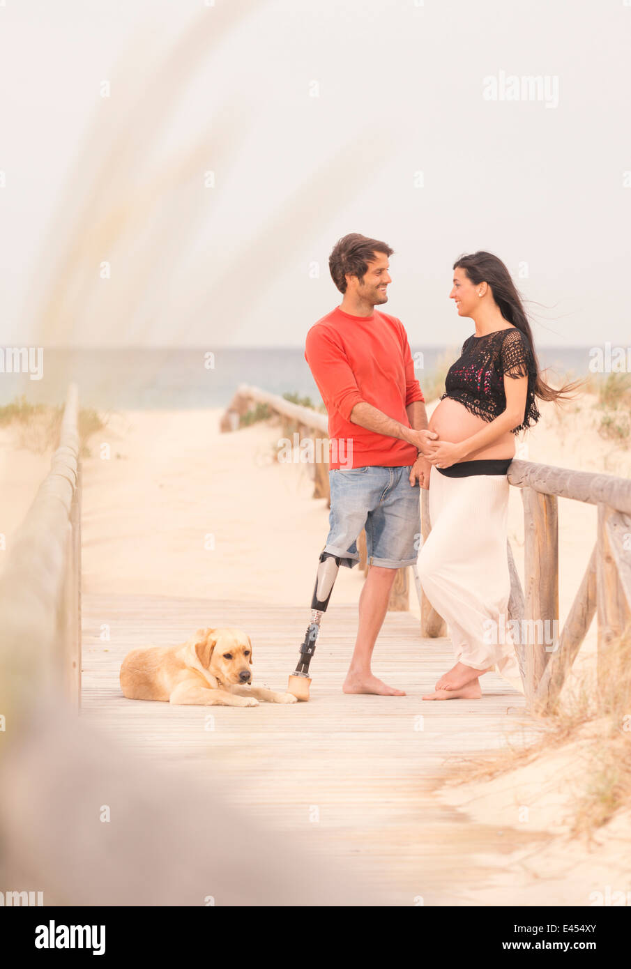 Disabled man and pregnant woman. A Couple in Love Stock Photo - Alamy