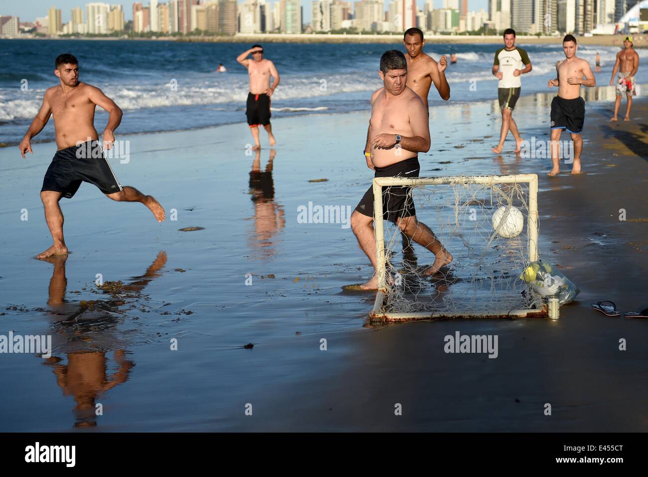 Fortaleza, Brazil. 2nd July, 2014. Men play football at the Iracema ...