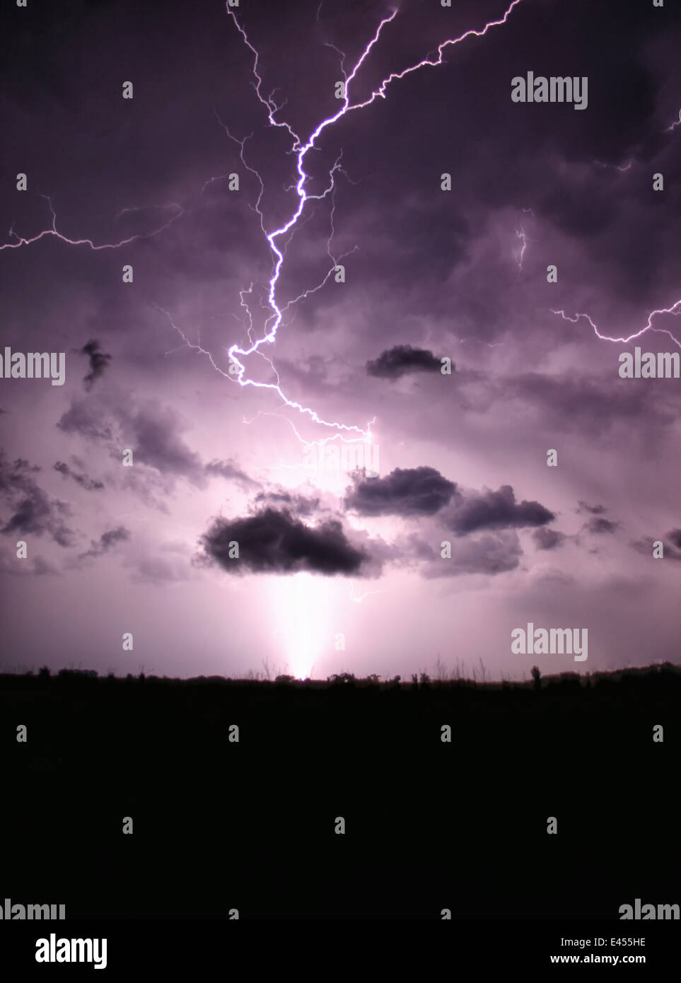 An extreme cloud-to-ground lightning bolt is followed by anvil crawlers ...