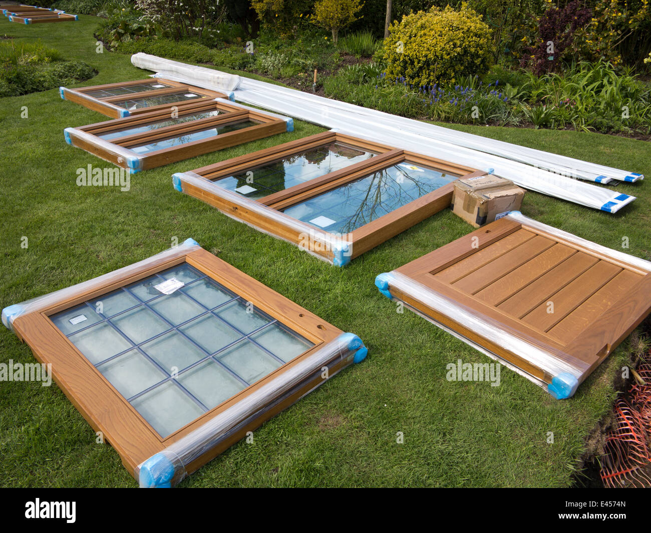 self building house, engineered oak leaded windows laid on grass after ...