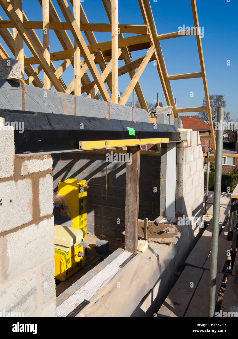 self building house, checking level of window lintel with prefabricated ...