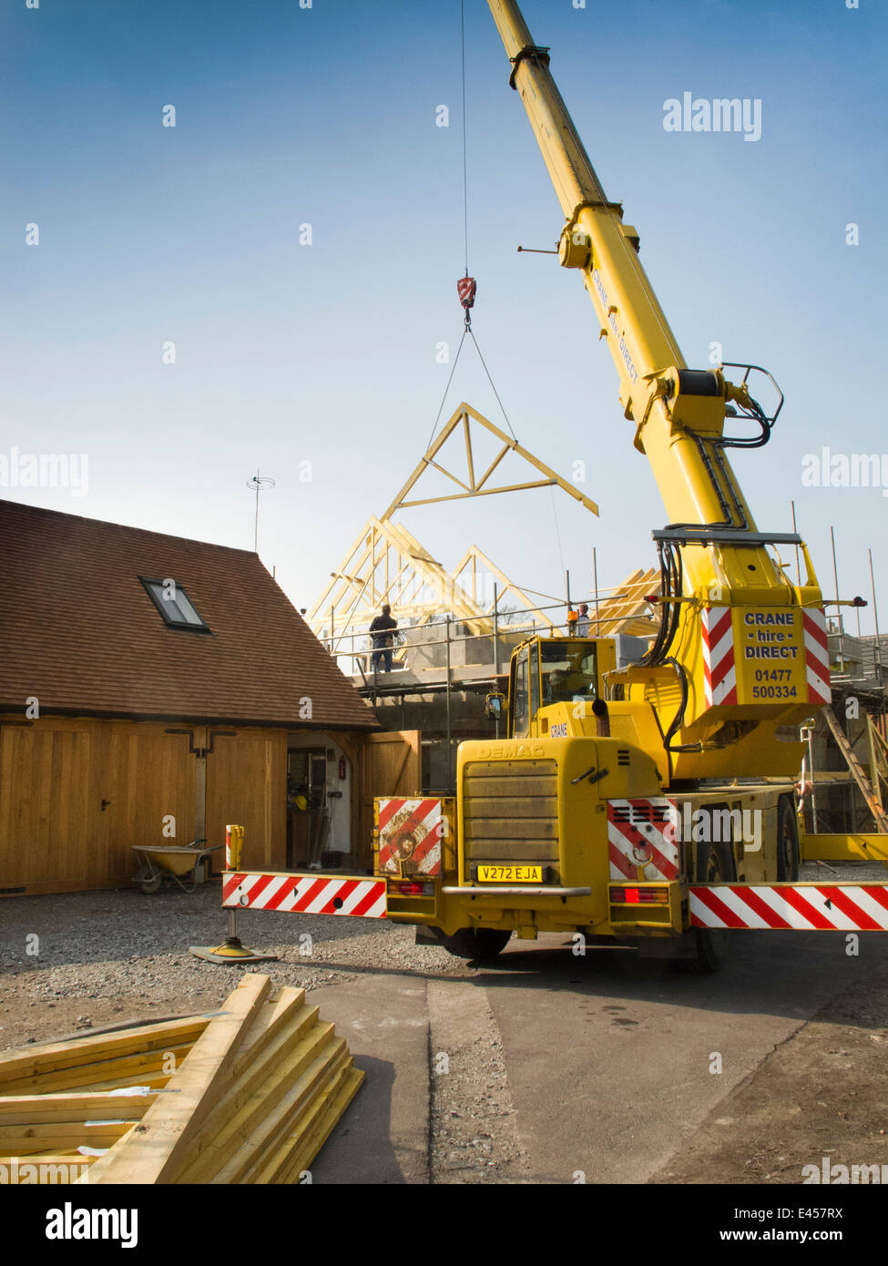 self building house, constructing roof, lifting roof trusses with ... self building house, constructing roof, lifting roof trusses with ...