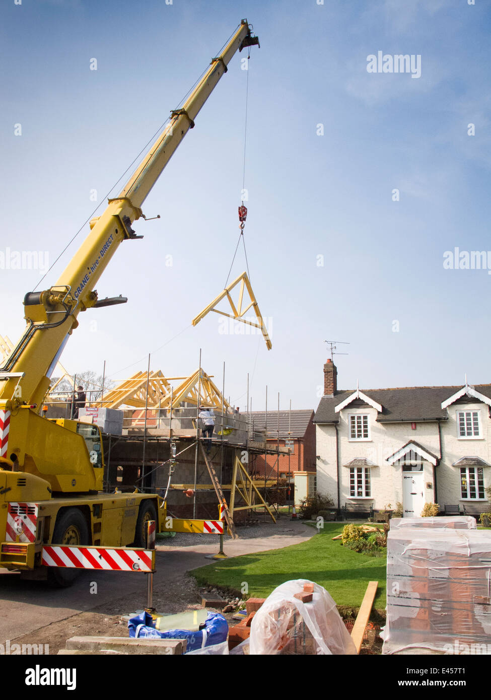 self building house, constructing roof, lifting roof trusses with ... self building house, constructing roof, lifting roof trusses with ...