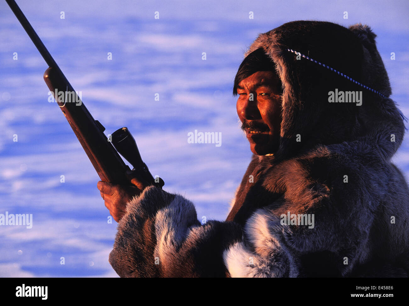 Inuit hunter in Caribou / Reindeer skin clothes, Canada Stock Photo - Alamy
