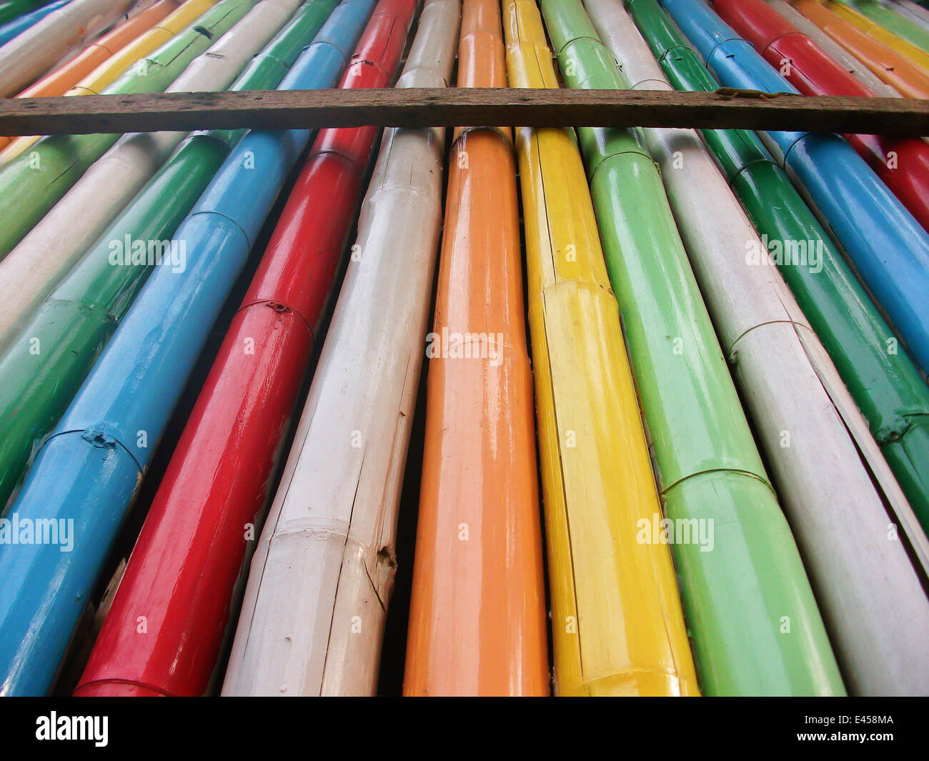 Wall made of bamboo colorful Stock Photo - Alamy