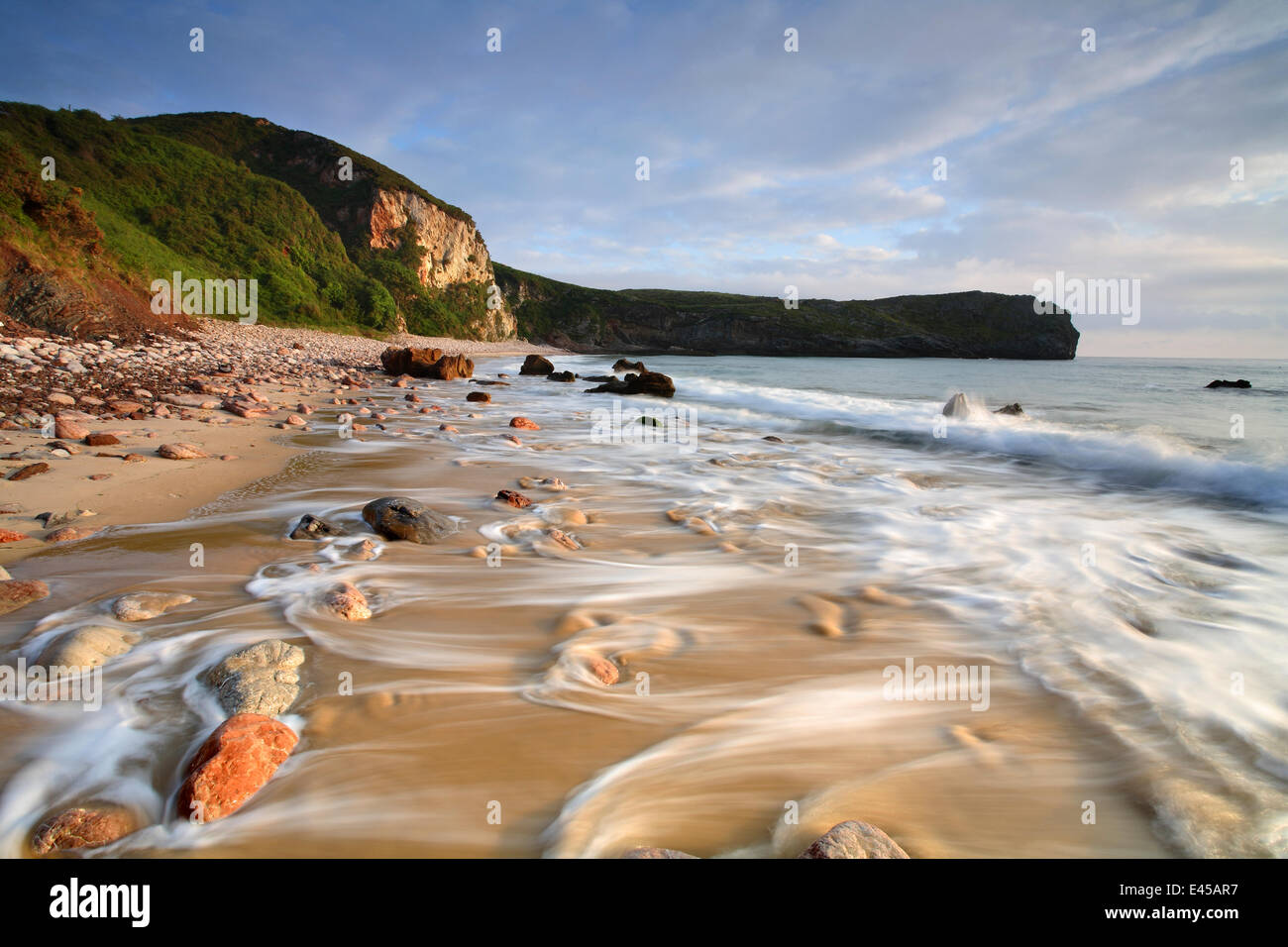 Coastline along Ballota beach, Llanes, Asturias, Spain - with tide ...