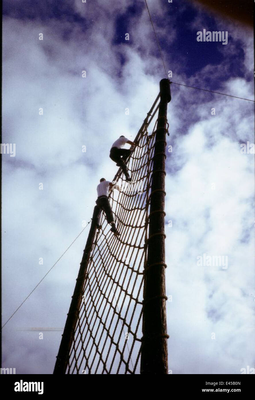 This photograph shows aviation personnel performing training exercises ...