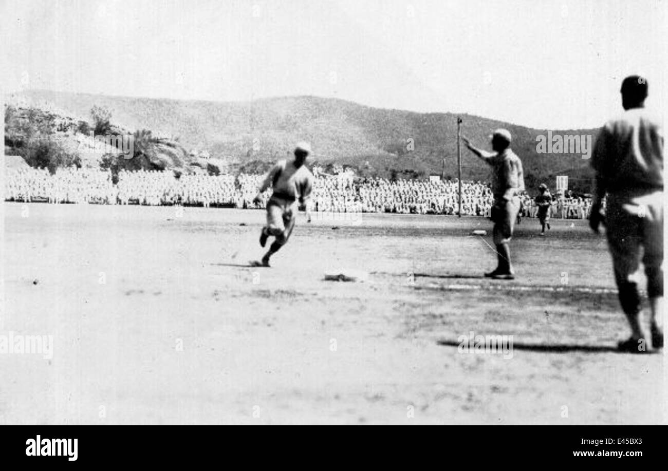 A photograph capturing a baseball game being played at Guantanamo Bay ...