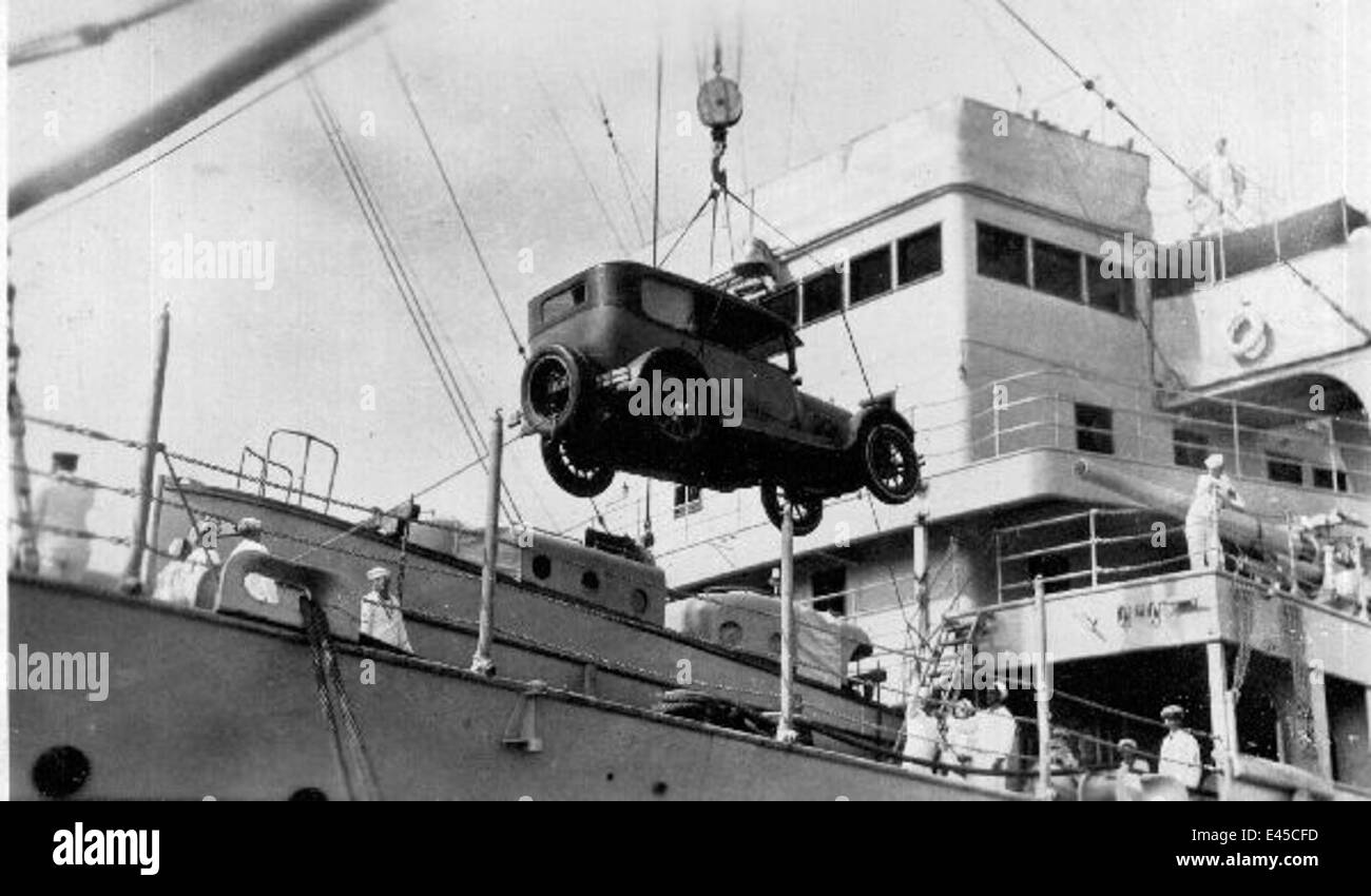 A photograph of an admiral's car being loaded onto a U.S. transport ...