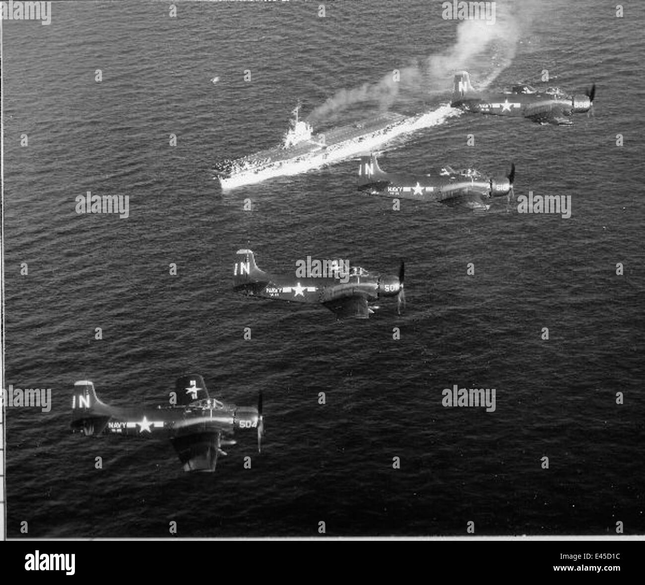A photograph of four AD Skyraider aircraft from VA-95 flying over the ...