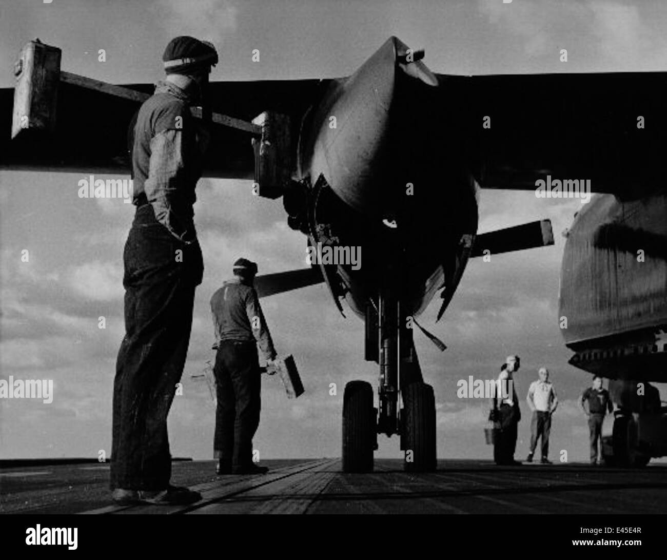 An image depicting an aircraft on the flight deck of a carrier, showing ...