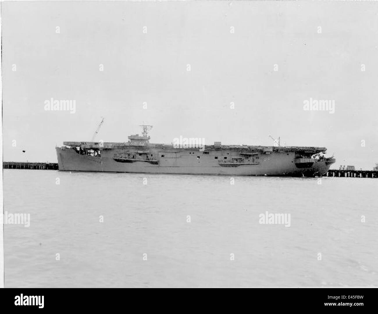 This image features the USS Barnes (CVE-20), an escort carrier used by ...