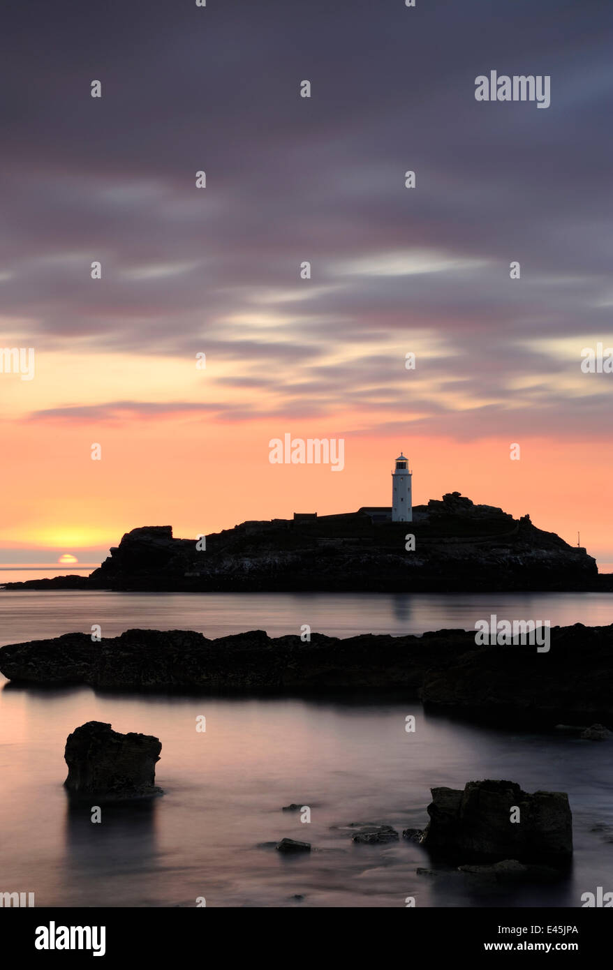Godrevy Lighthouse at sunset, nr Hayle, Cornwall, UK. June 2009 Stock ...