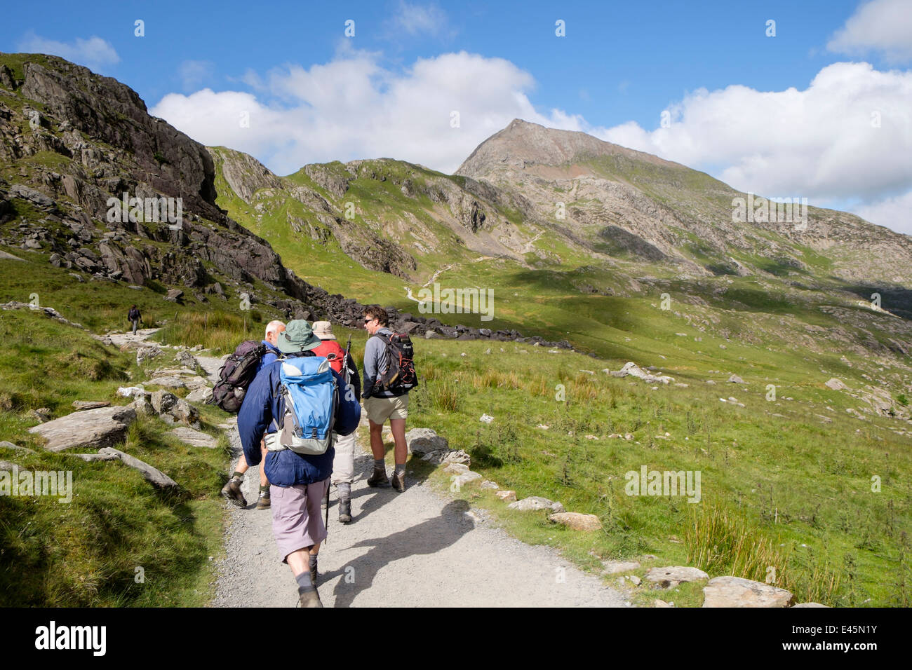 Walkers on Pyg Track walking towards Crib Goch at start of Snowdon ...