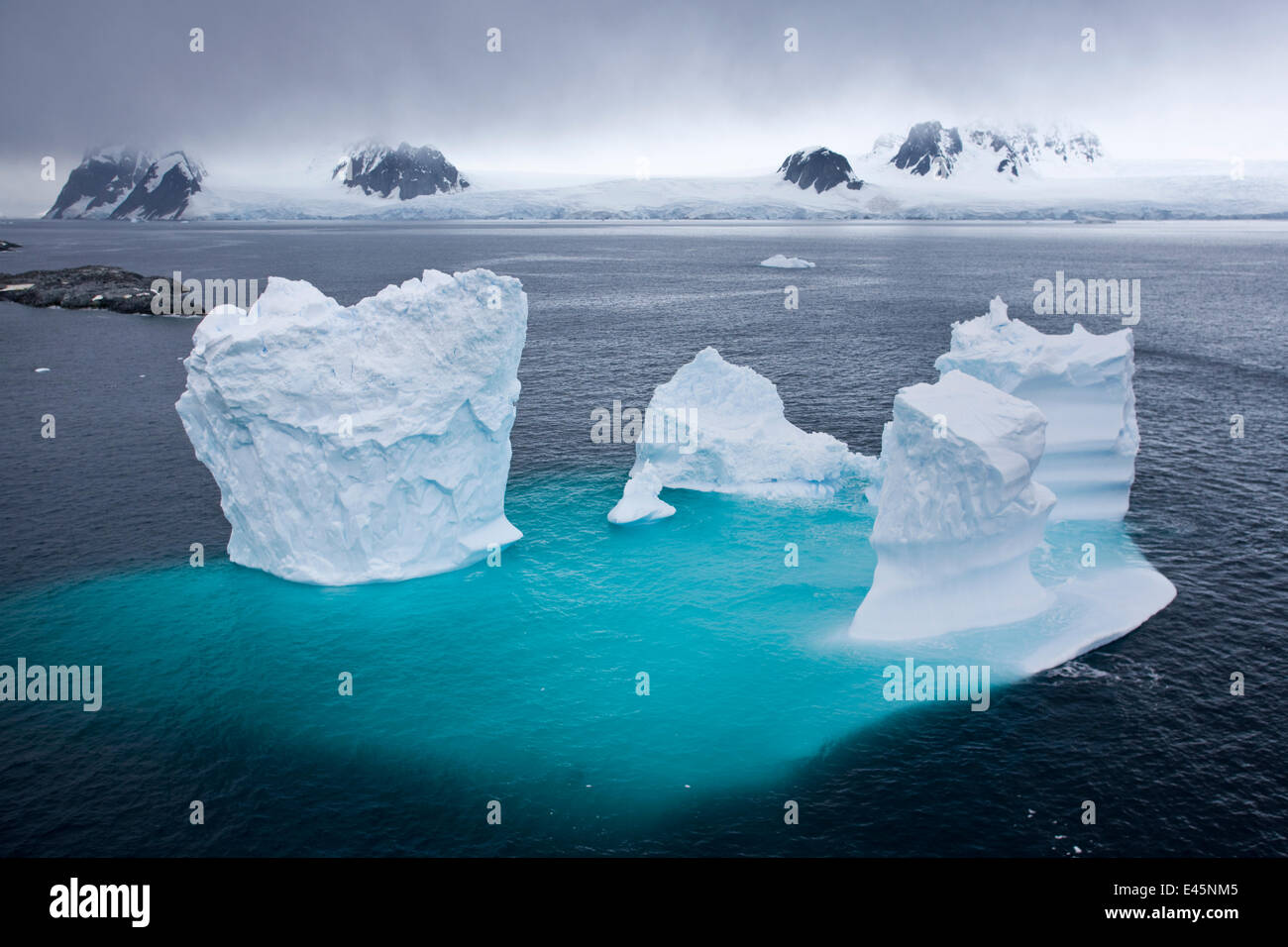 Aerial view of iceberg, with majority of berg visible under the water ...