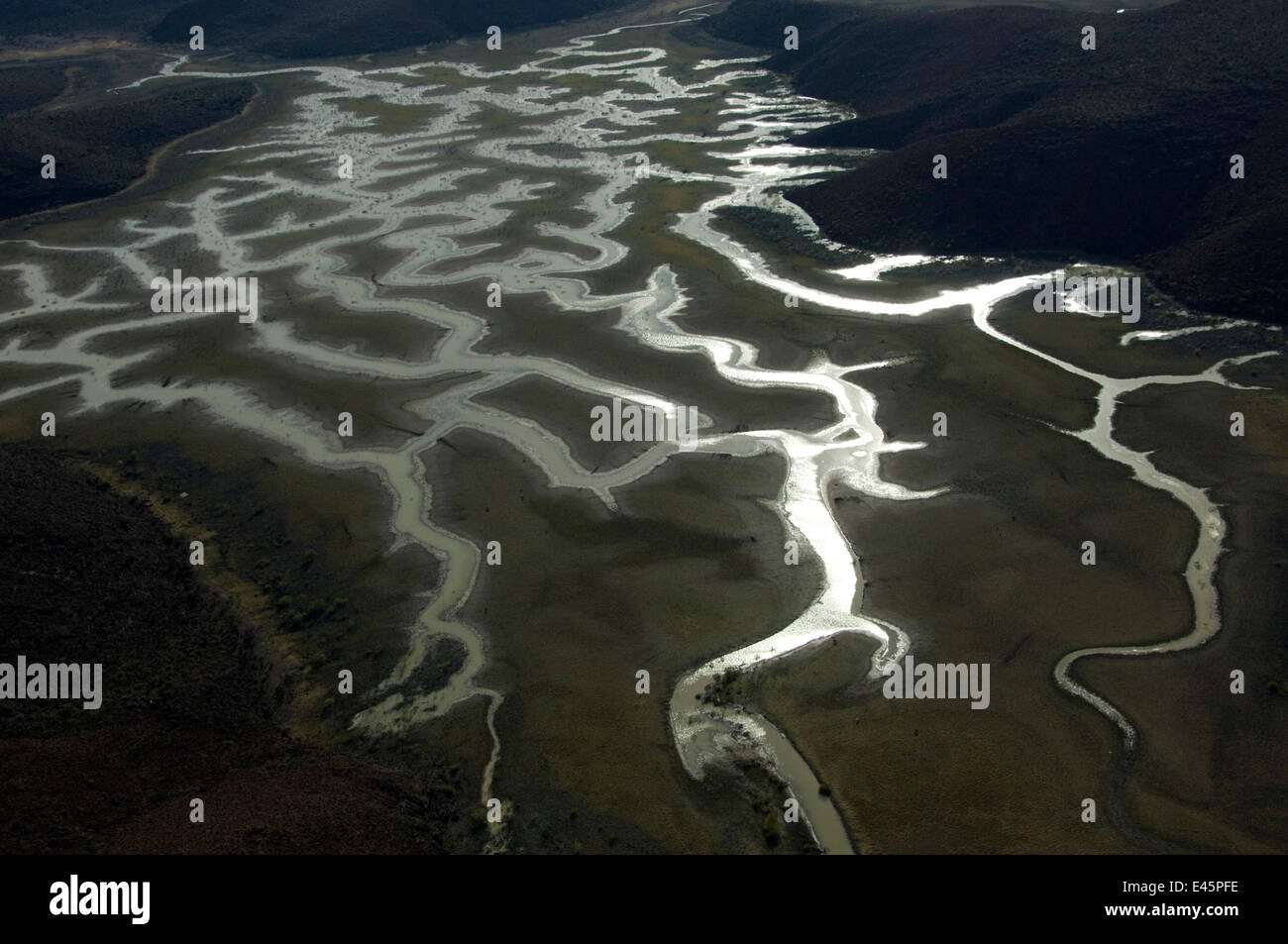 Aerial view of Llano de Cachigui with water rivulets following heavy ...