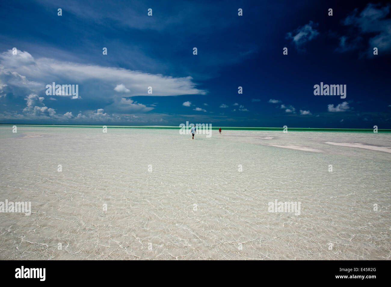 Distant people in the shallows of the Exumas, Bahamas, Caribbean. June ...