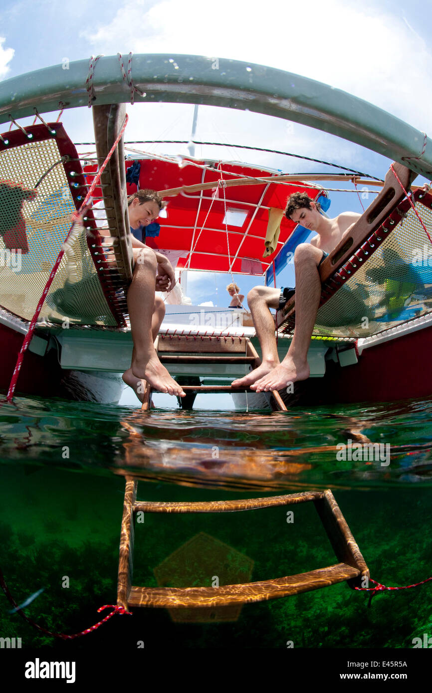 Split level view of young men sitting on the trampolines of 30ft Tiki ...