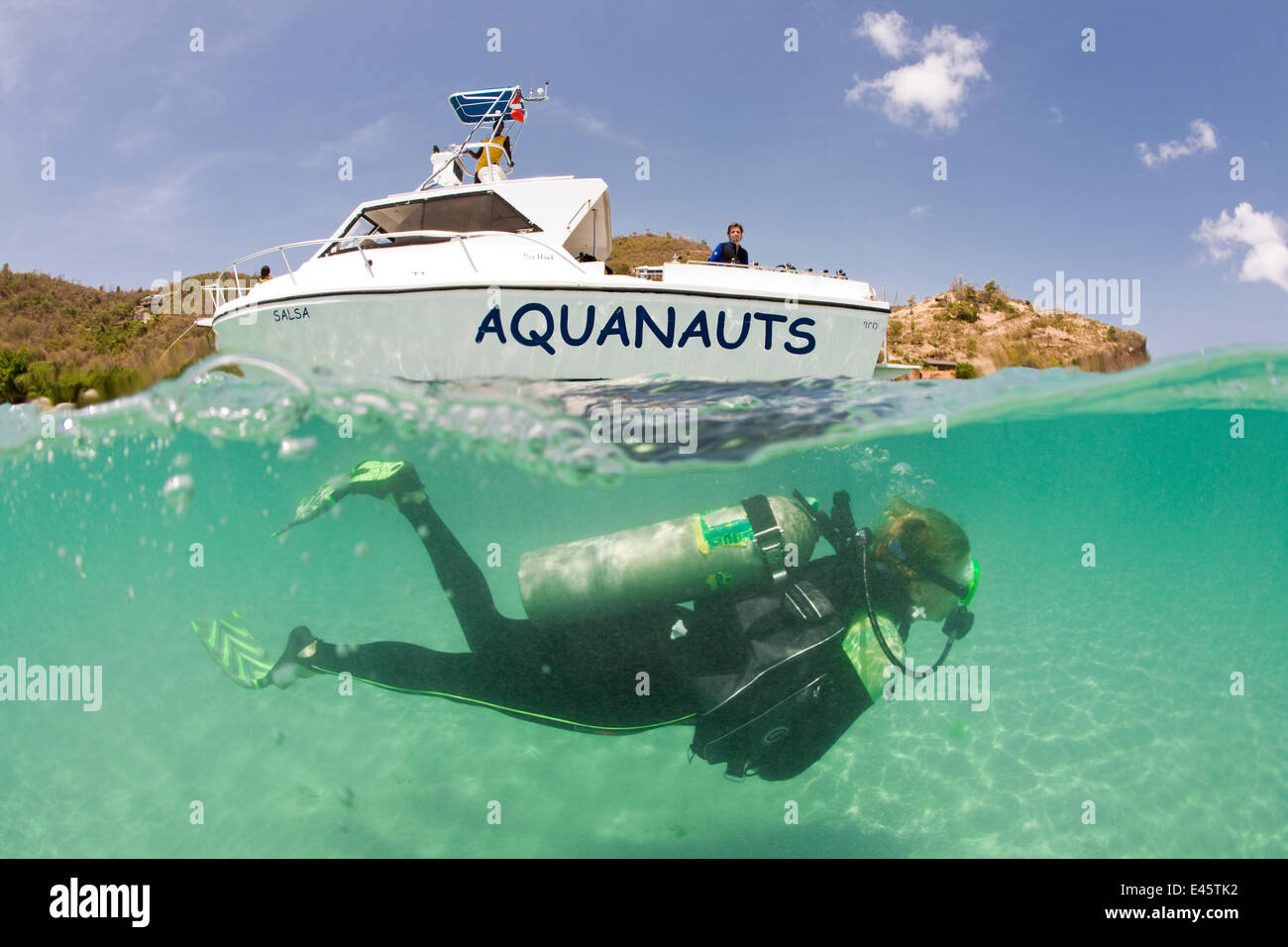Split level view of scuba diver with PR Aquanauts boat in Grenada, Caribbean. May 2009. Property ...