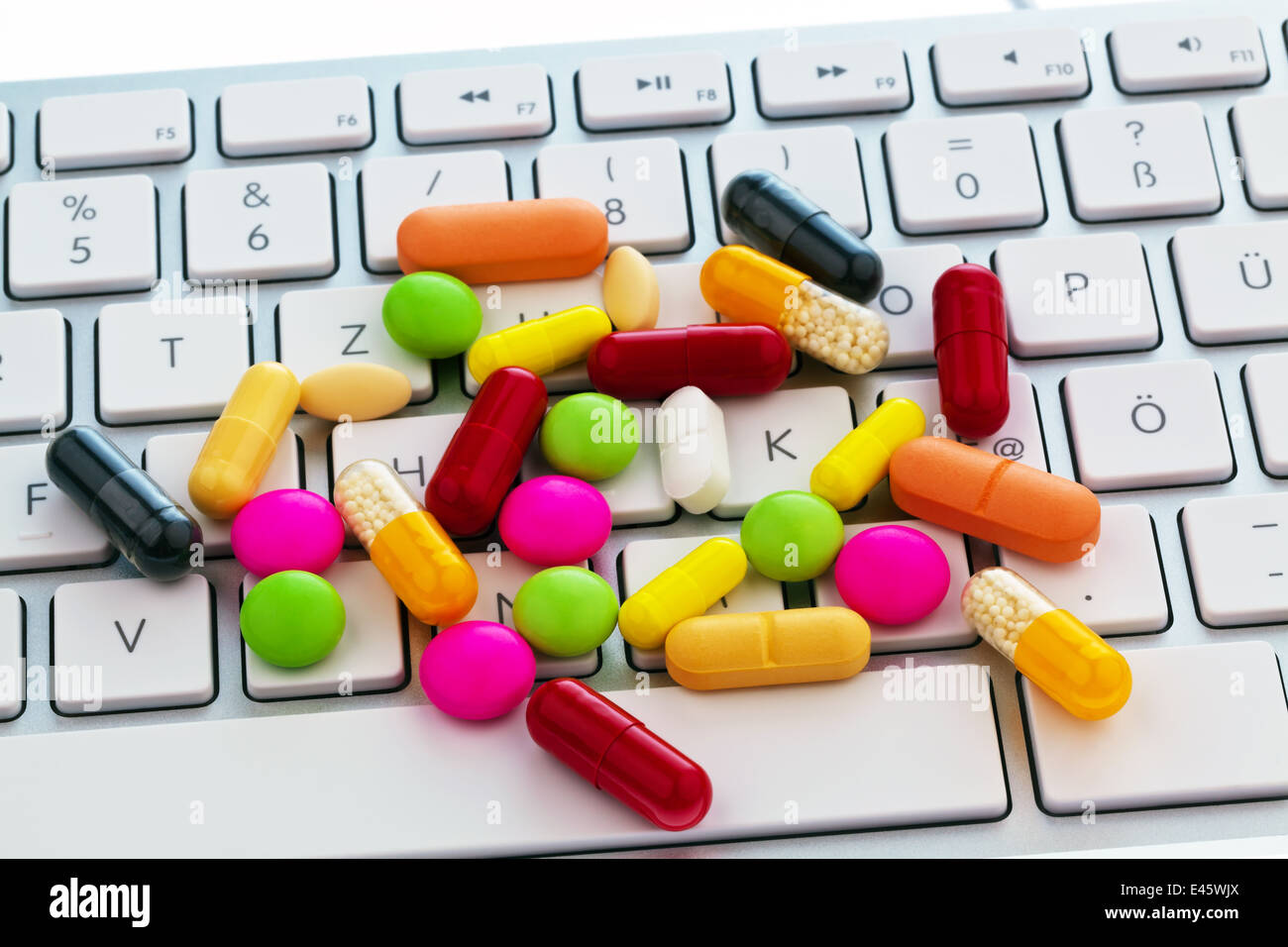 Many tablets and computer keyboard. Symbolic photo for Online and ...