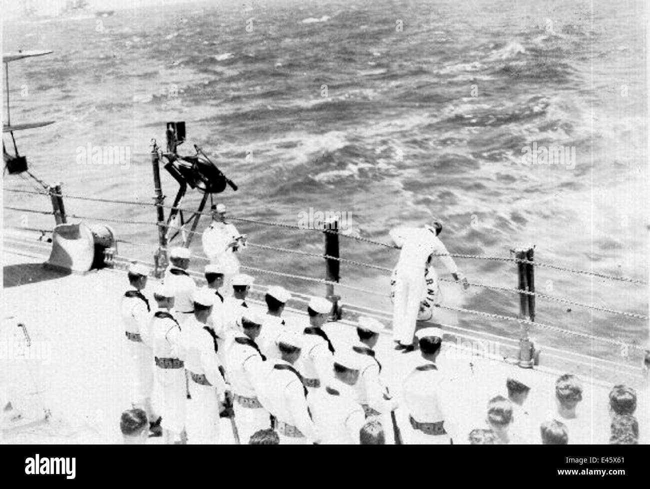 Photograph of a burial at sea ceremony aboard the USS Idaho (BB 44) in ...