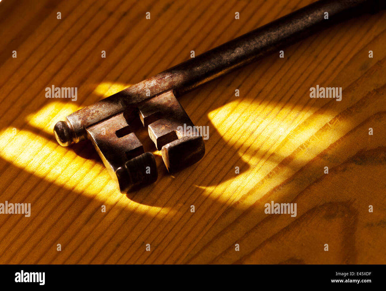 An old key lying on a white background Stock Photo - Alamy