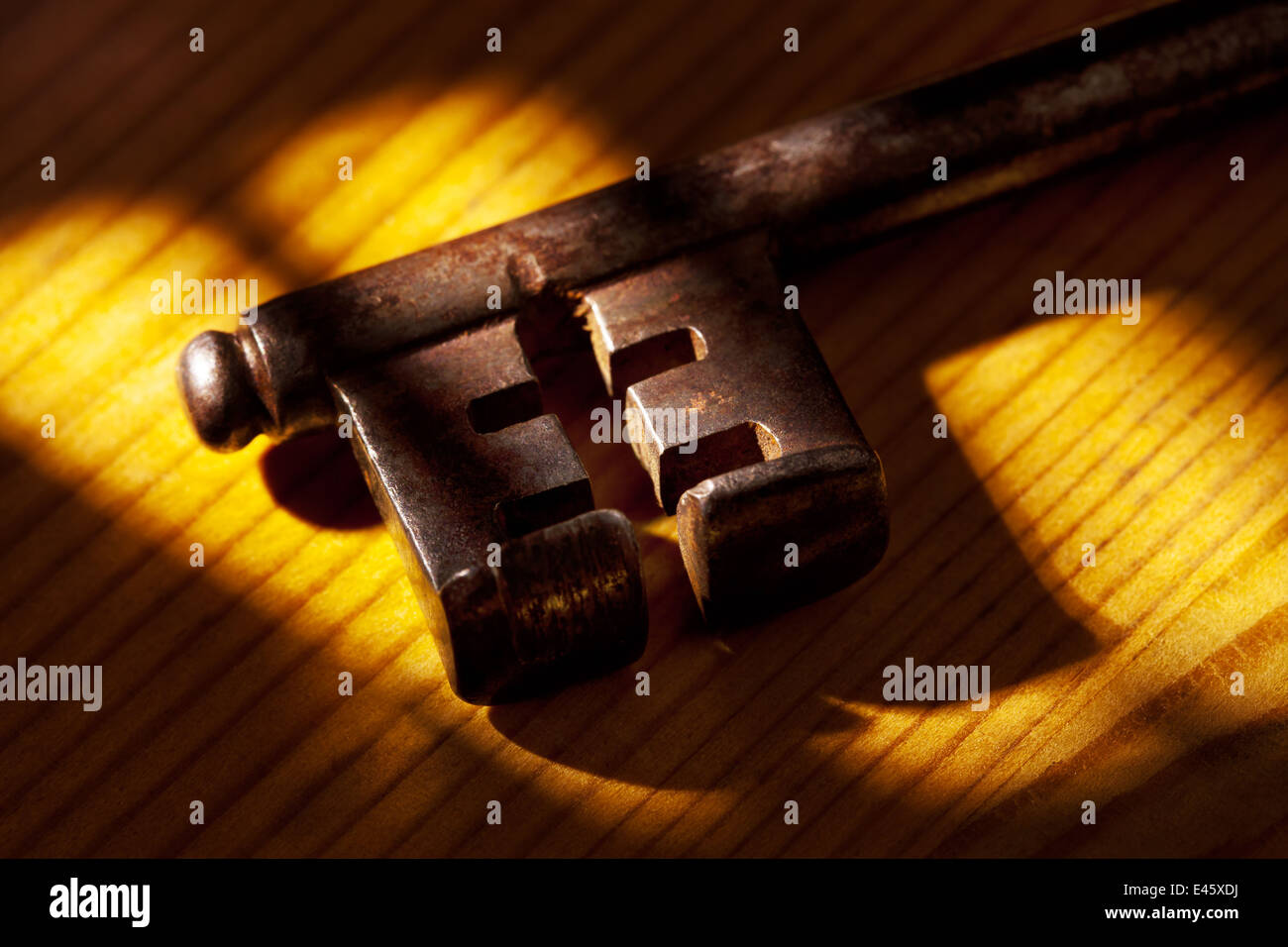 An old key lying on a white background Stock Photo - Alamy