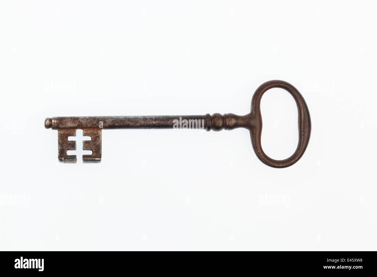 An old key lying on a white background Stock Photo - Alamy