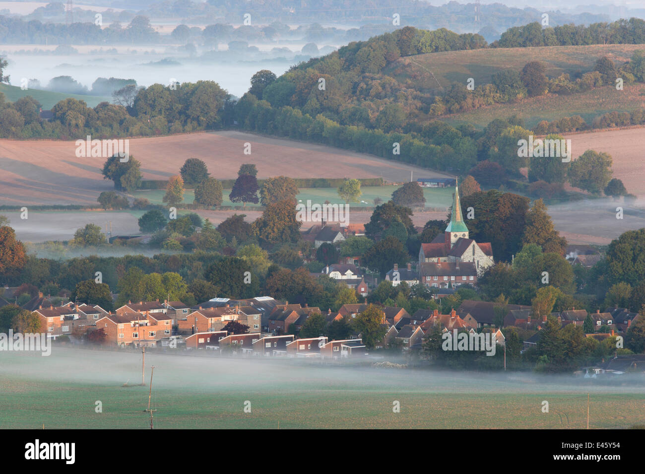 Dawn mist on the fields around the village of South Harting. South ...