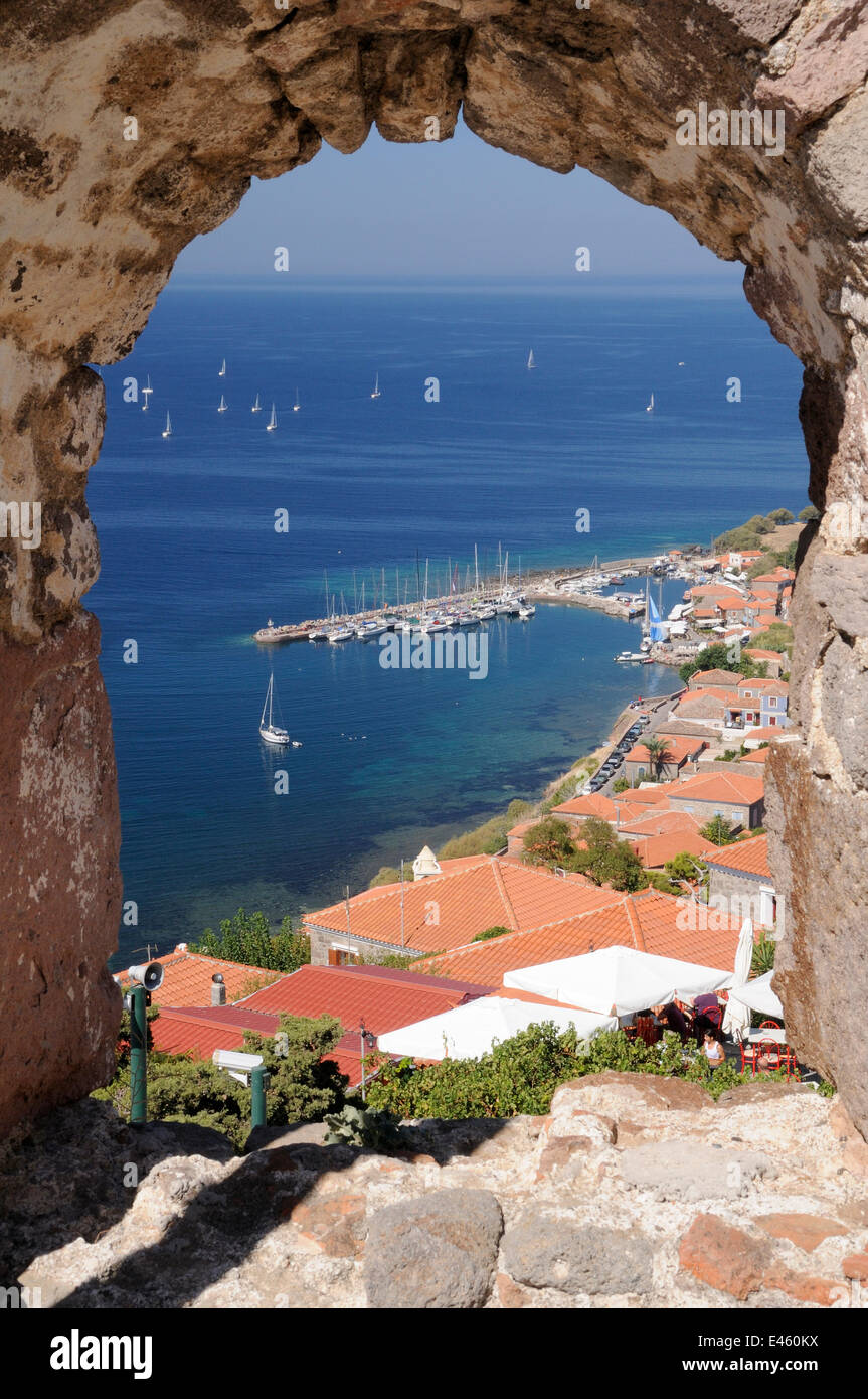 Molyvos / Mithymna harbour, viewed through an arched window of the 13th ...