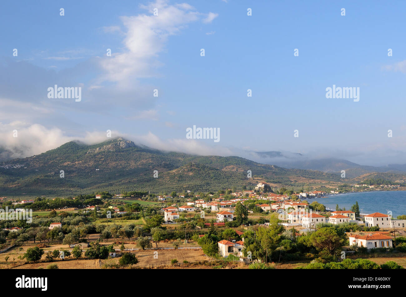 Overview of Petra village, with mist rising from mountains in the ...