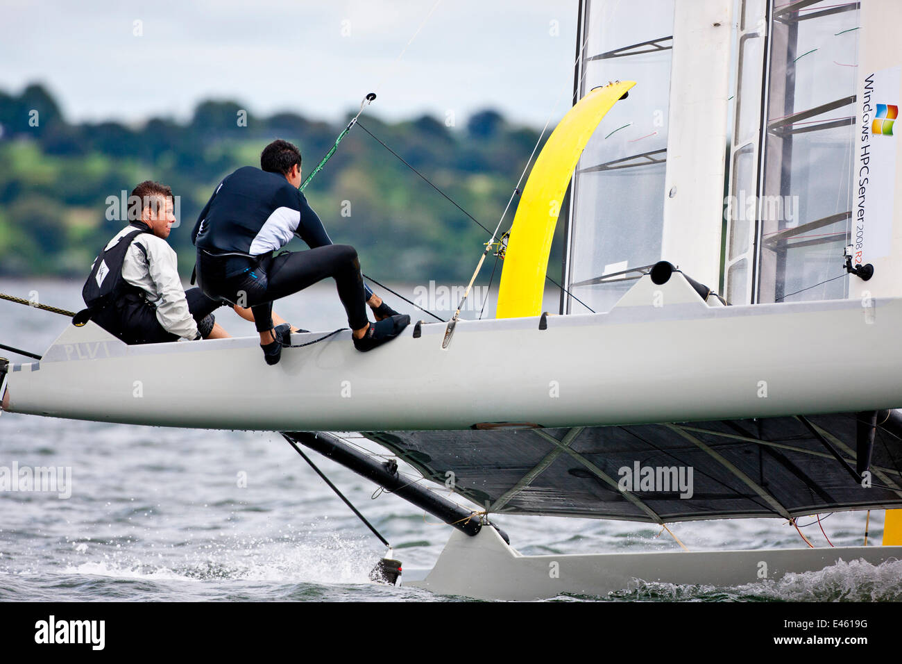 Crew trapezing on board C-Class catamaran during training for Little ...