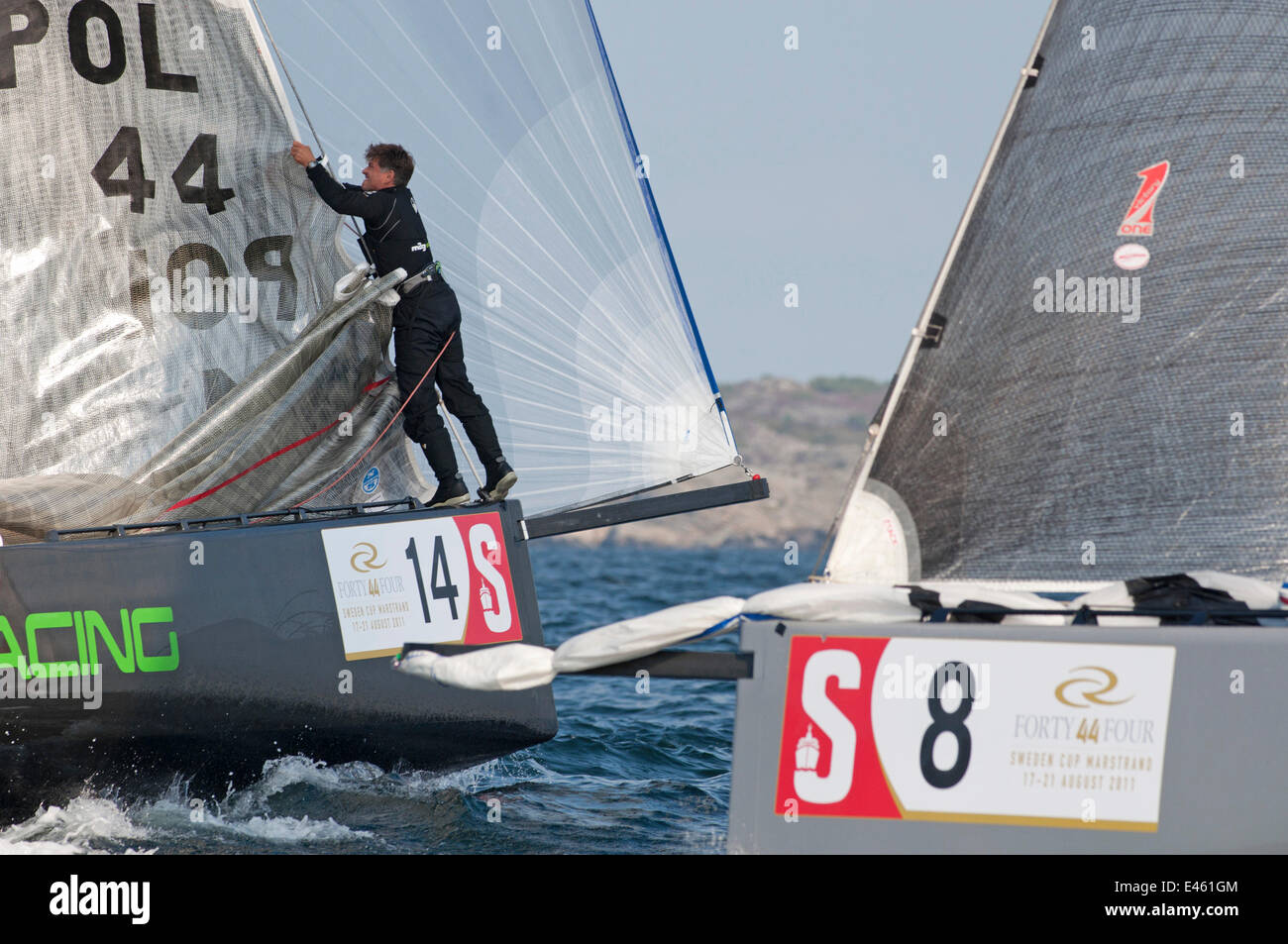 Lowering foresail following spinnaker hoist on board yacht during the ...