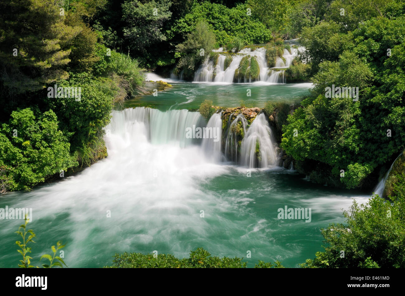 Krka river flowing over a series of travertine dams or barriers at ...