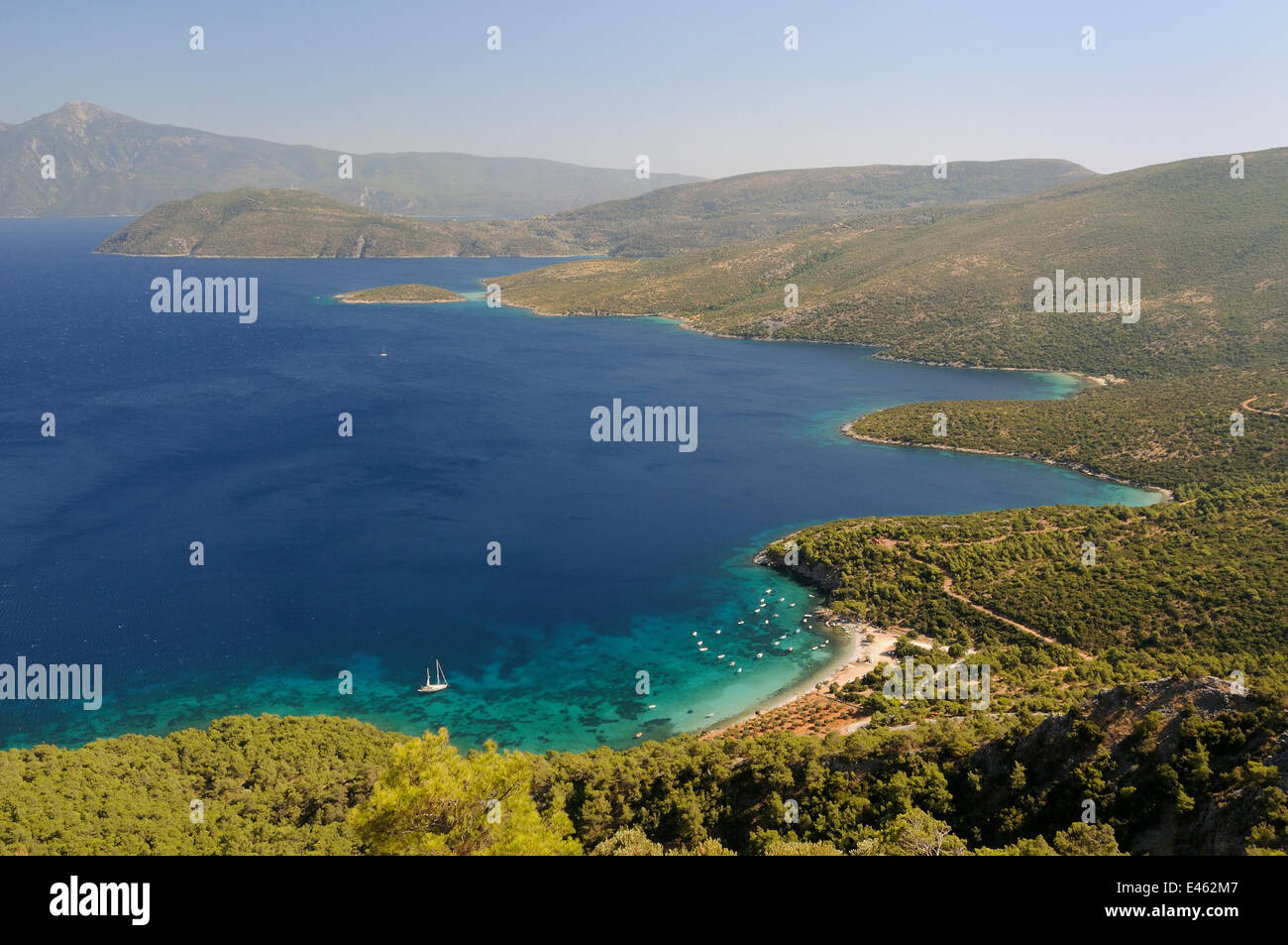 Mourtia beach and bay with the southeast tip of Samos and Mount Mycale ...