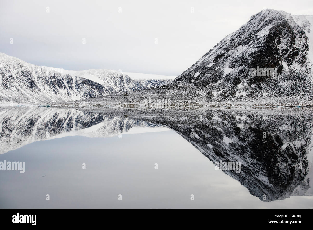 Arctic mountains and reflection in water. Nordaustlandet, Svalbard ...