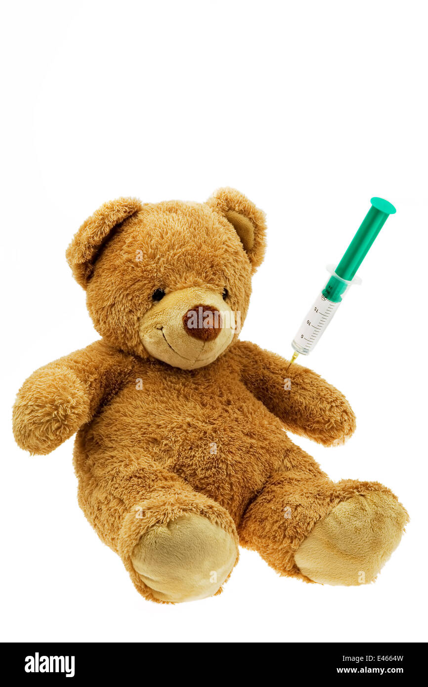A Teddy gets an injection. Vaccination and syringe Stock Photo - Alamy