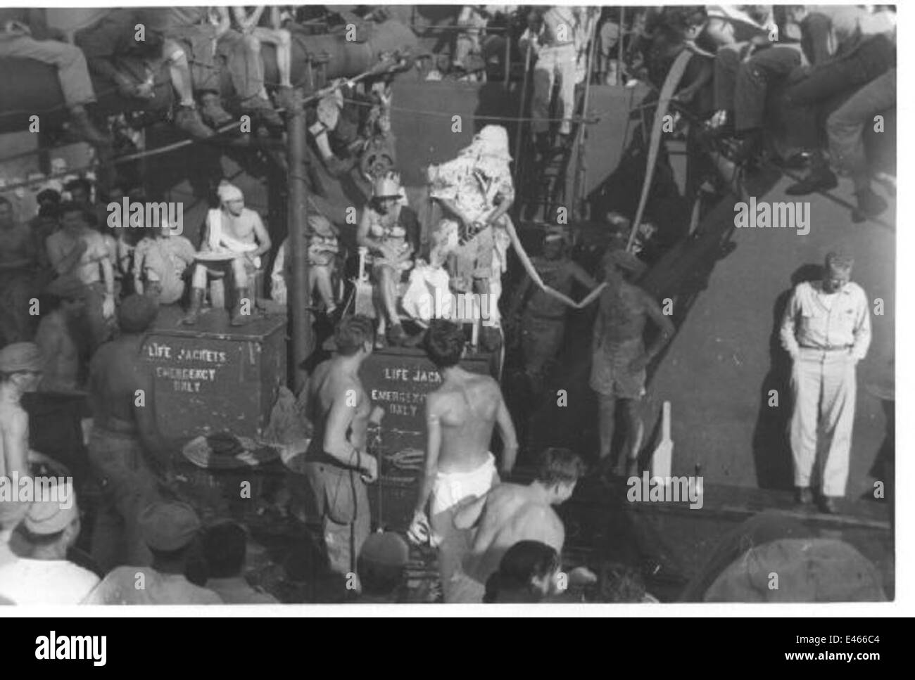 This image captures the crossing the equator ceremony held on a troop ...