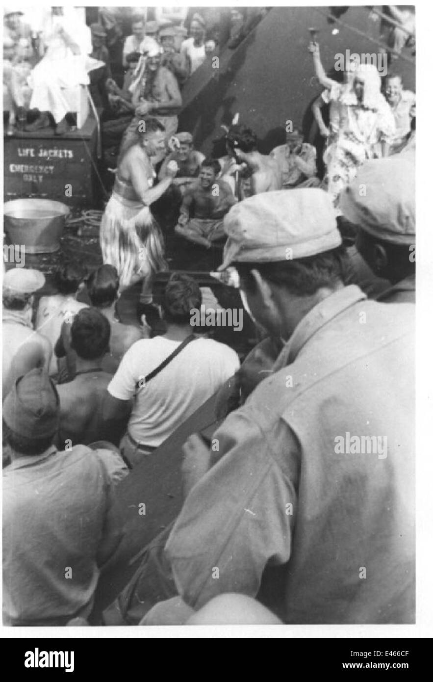 This image captures the crossing of the equator ceremony aboard a troop ...