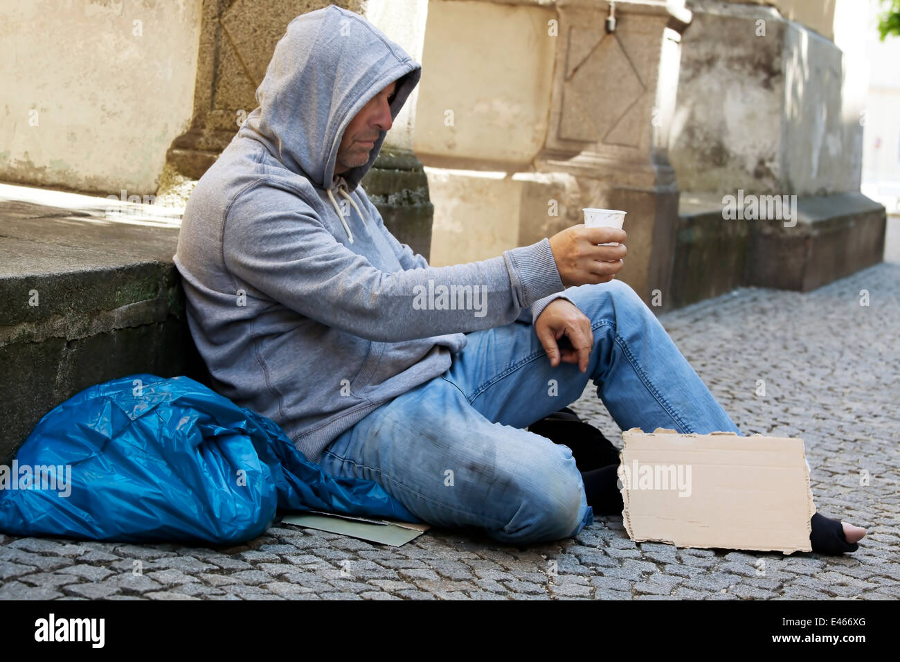 An unemployed homeless beggar is hungry Stock Photo - Alamy