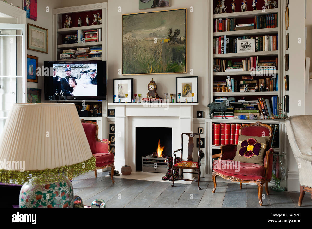 London home, living room with lit fireplace Stock Photo - Alamy